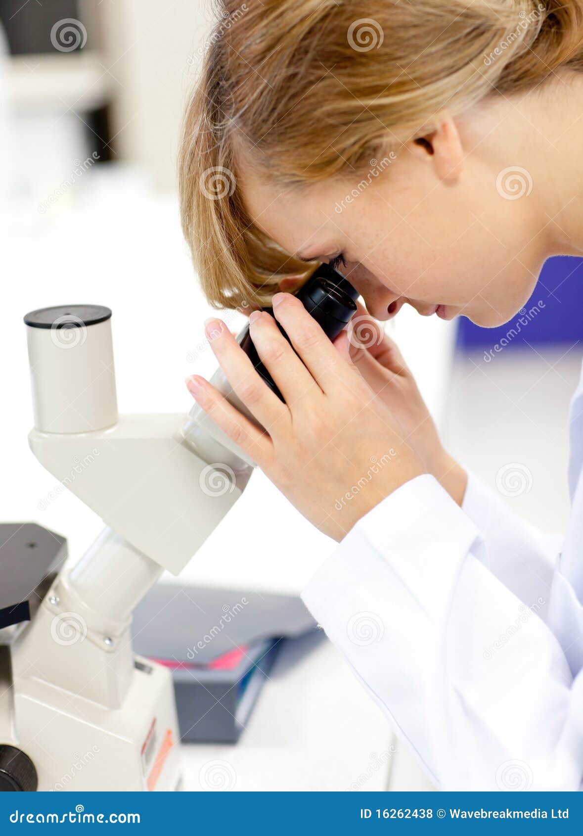 Concentrated Scientist Looking through Microscope Stock Photo - Image ...