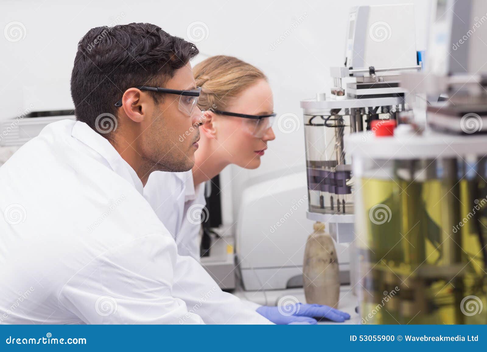 Concentrated Scientists Observing Together Stock Photo - Image of ...