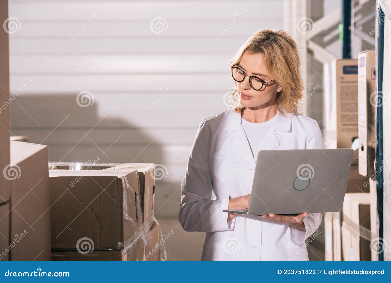 Concentrated Storekeeper Using Laptop while Looking Stock Photo - Image ...