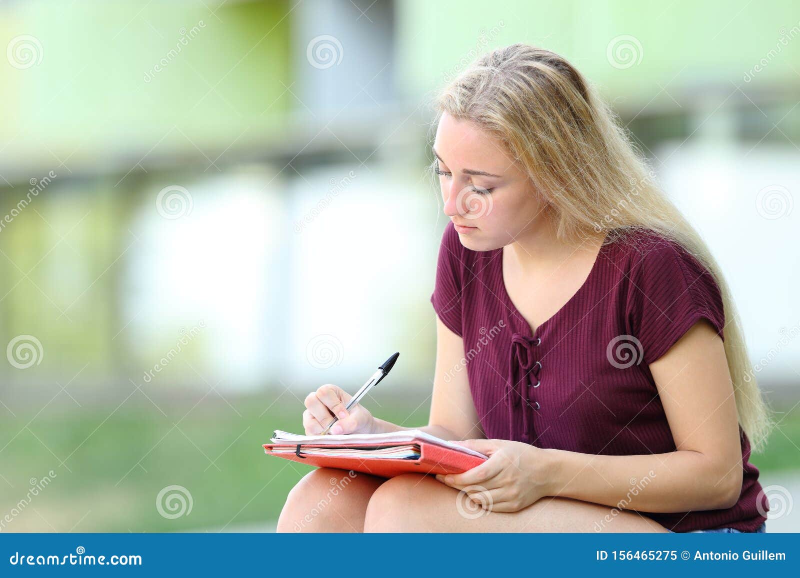 Concentrated Student Studying Taking Notes in a Campus Stock Image ...