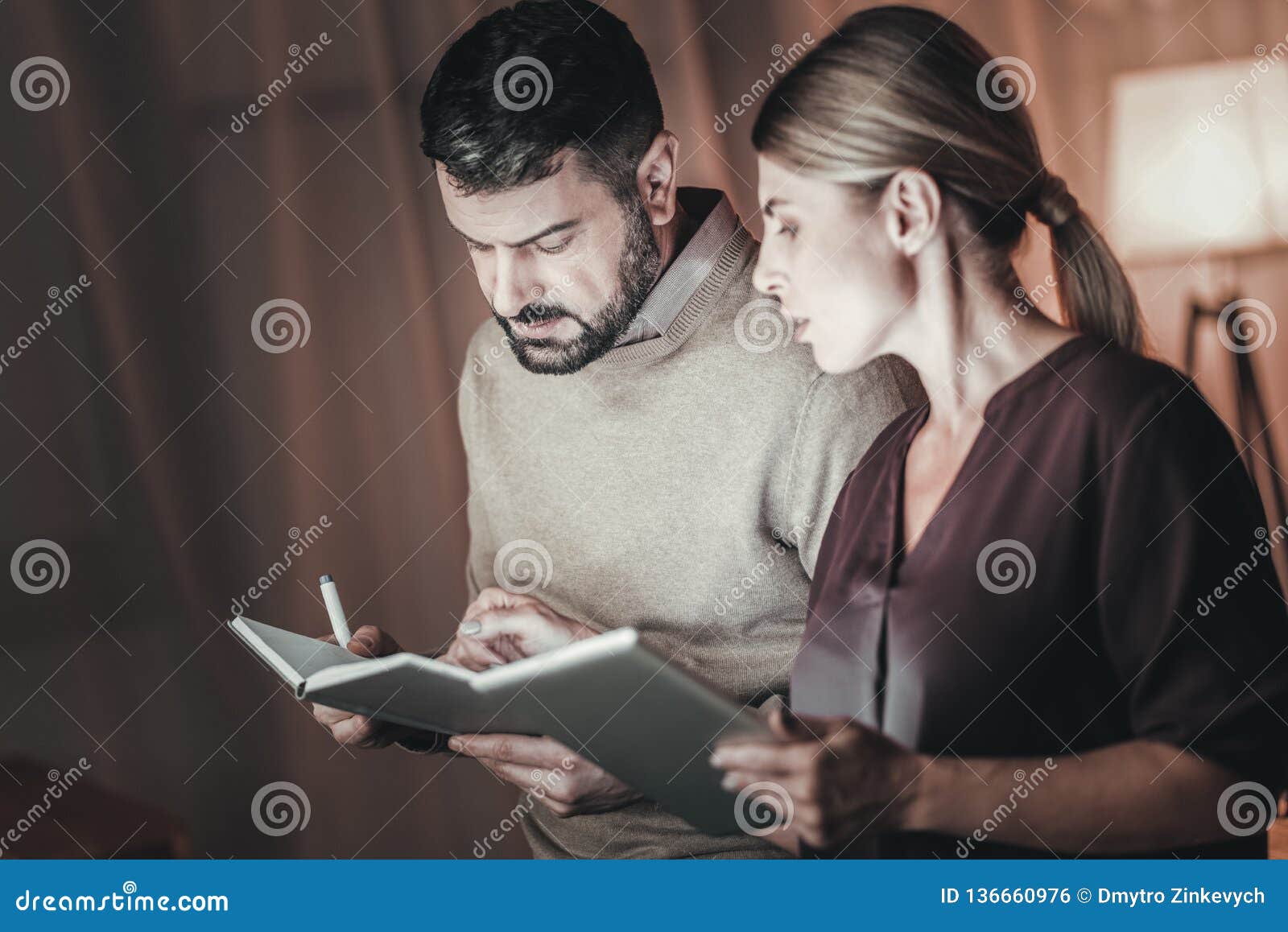 Concentrated Two Colleagues Comparing Notes Stock Photo - Image of ...