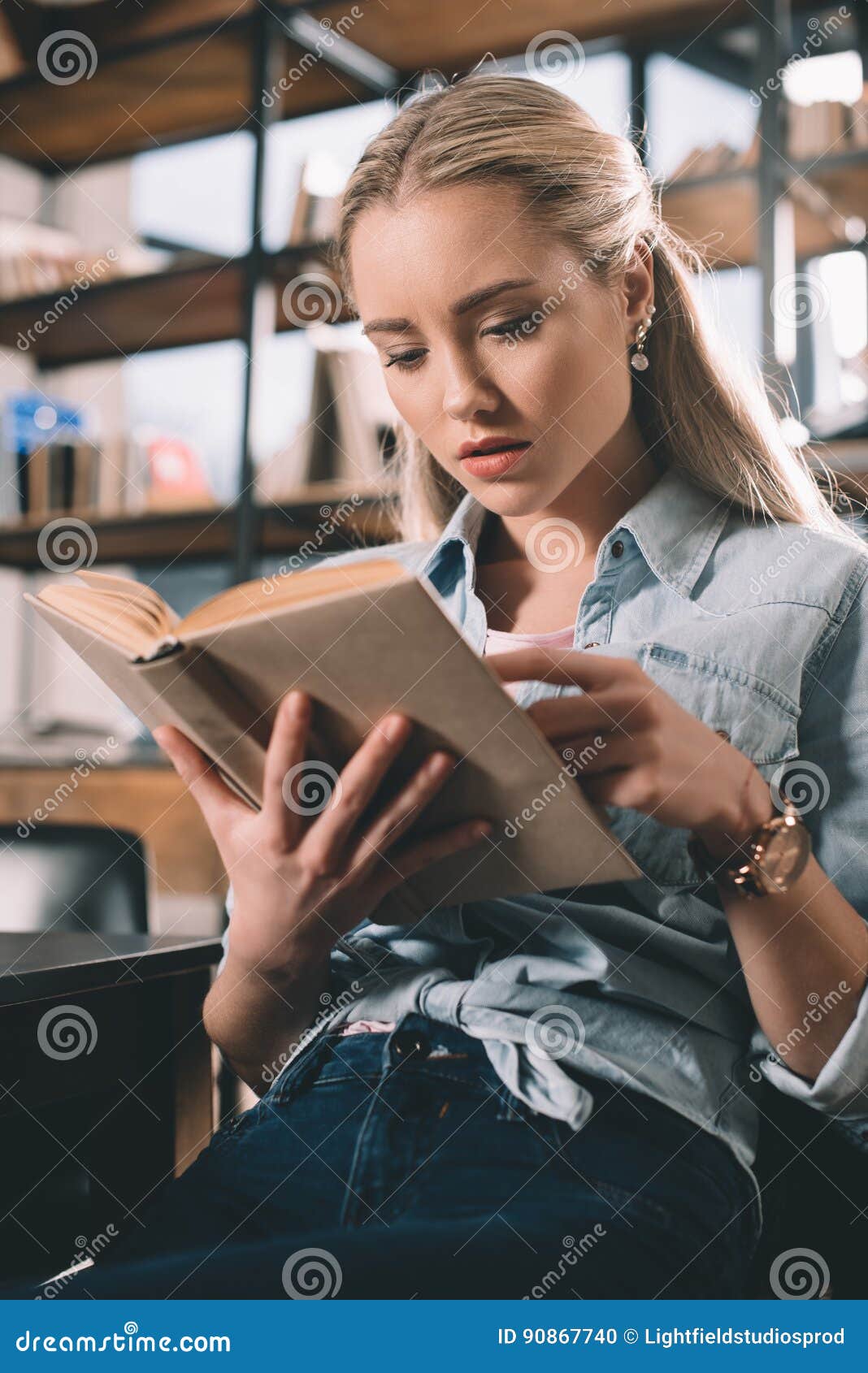Concentrated Woman Student Reading Book in Library Stock Photo - Image ...