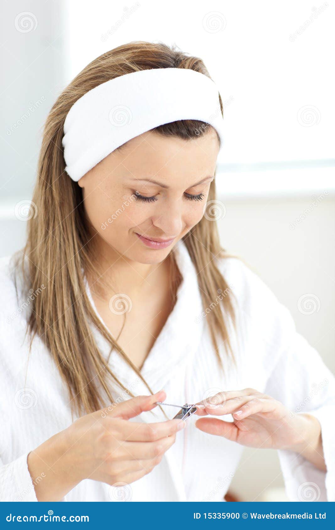 Concentrated Woman Using a Nail Scissors Stock Photo - Image of ...