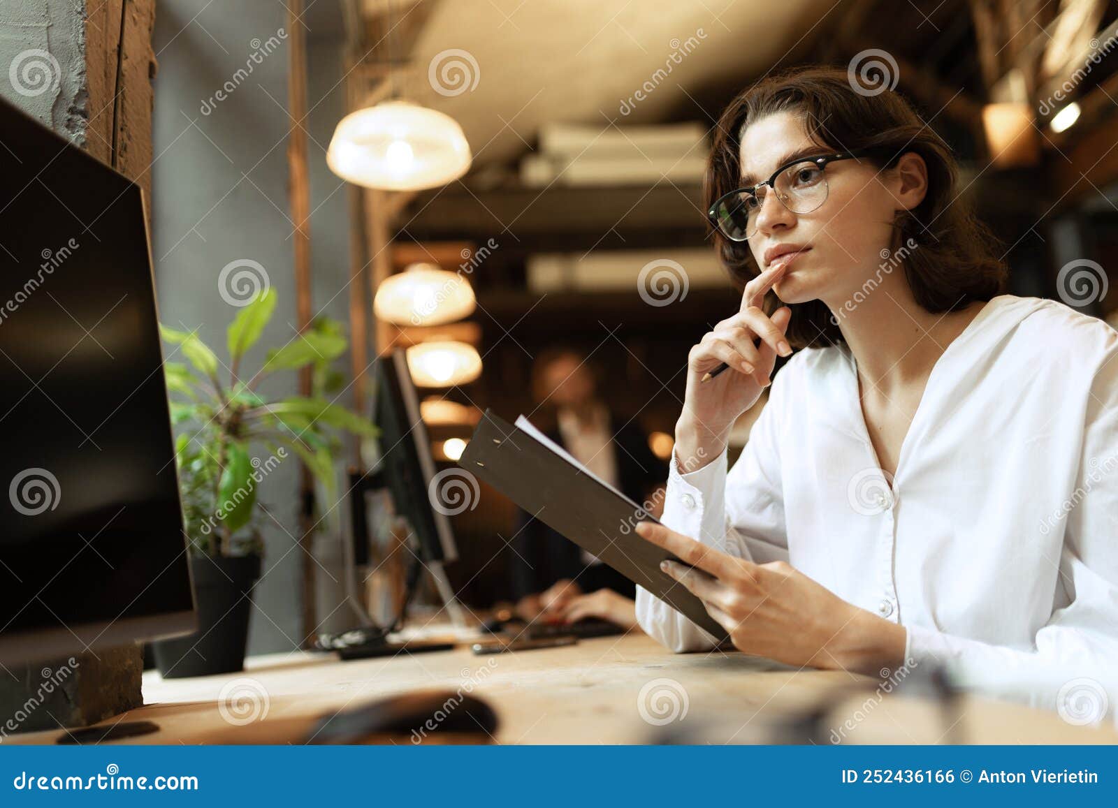 Young Concentrated Woman Working at the Office on New Project. Stock ...