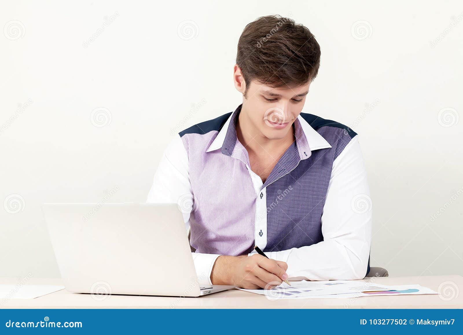 Concentrated At Work Confident Man Writing Something In Note Pad While