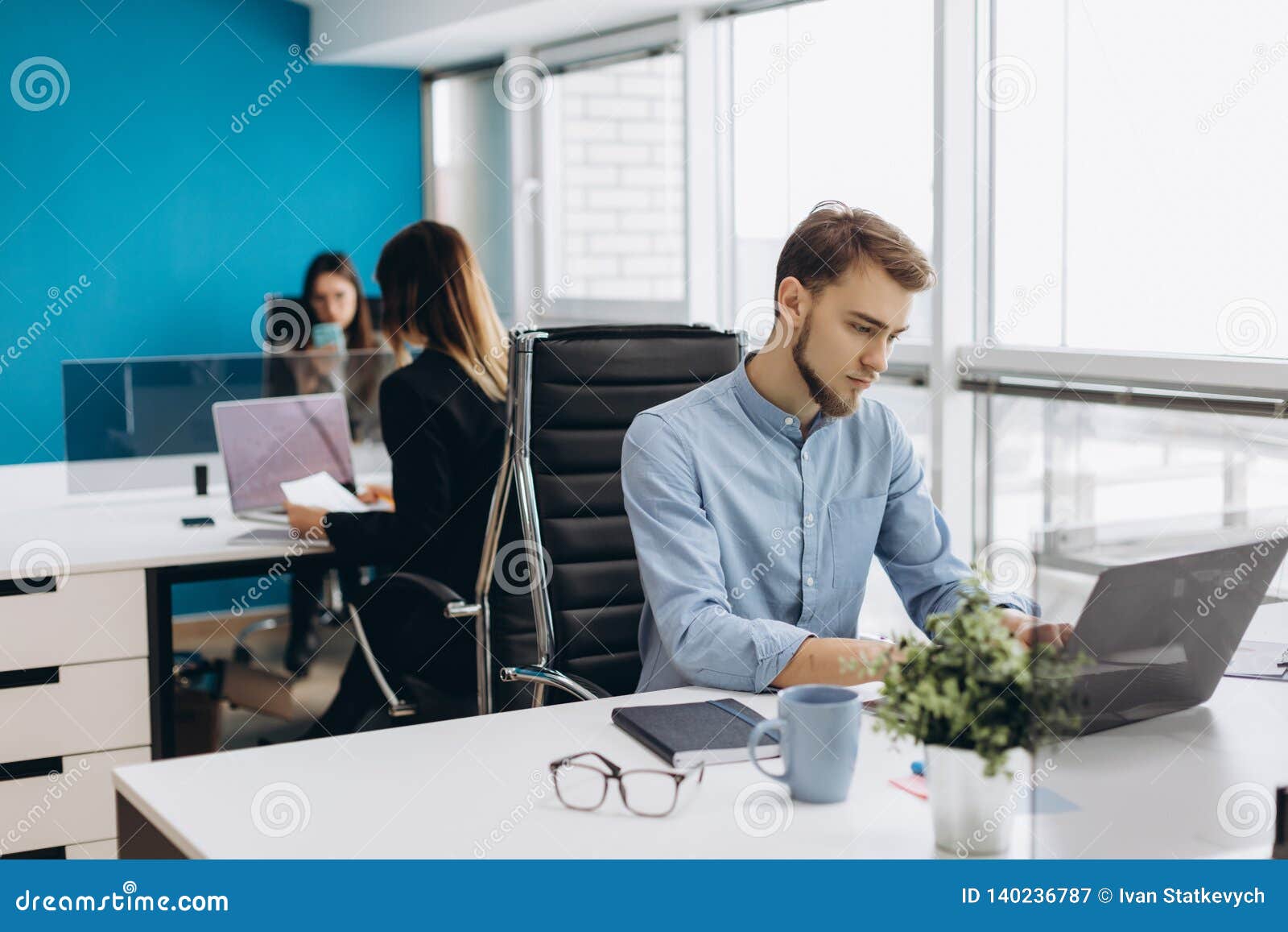 Concentrated on Work. Concentrated Young Beard Man Working on Laptop ...