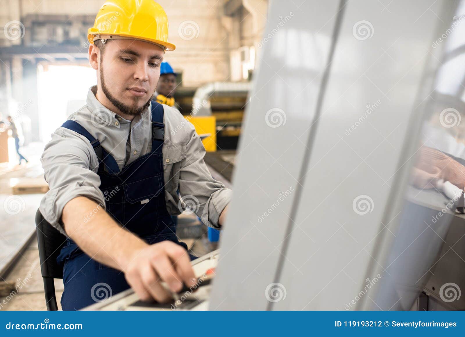 Concentrated Worker Operating Manufacturing Machine Stock Photo - Image ...