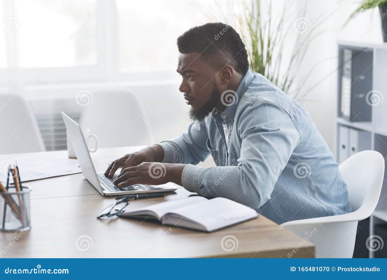 Concentrated Young African Worker Using Laptop in Office Stock Photo ...