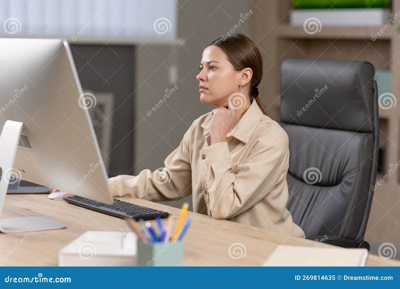 Concentrated Young Beautiful Businesswoman Working on Computer in ...