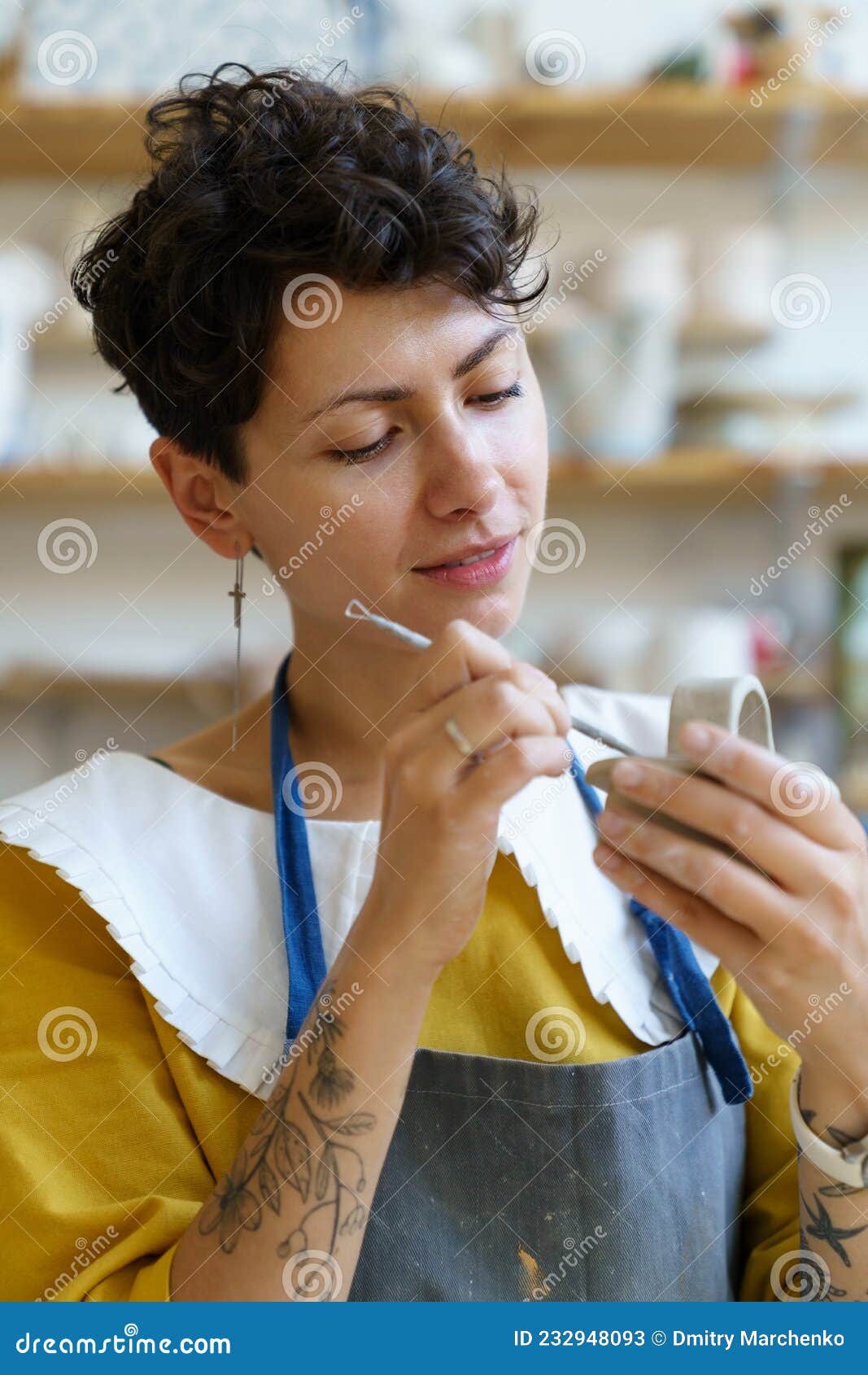 Young Female Ceramic Master Using Scraper for Shaping Pottery Tableware ...