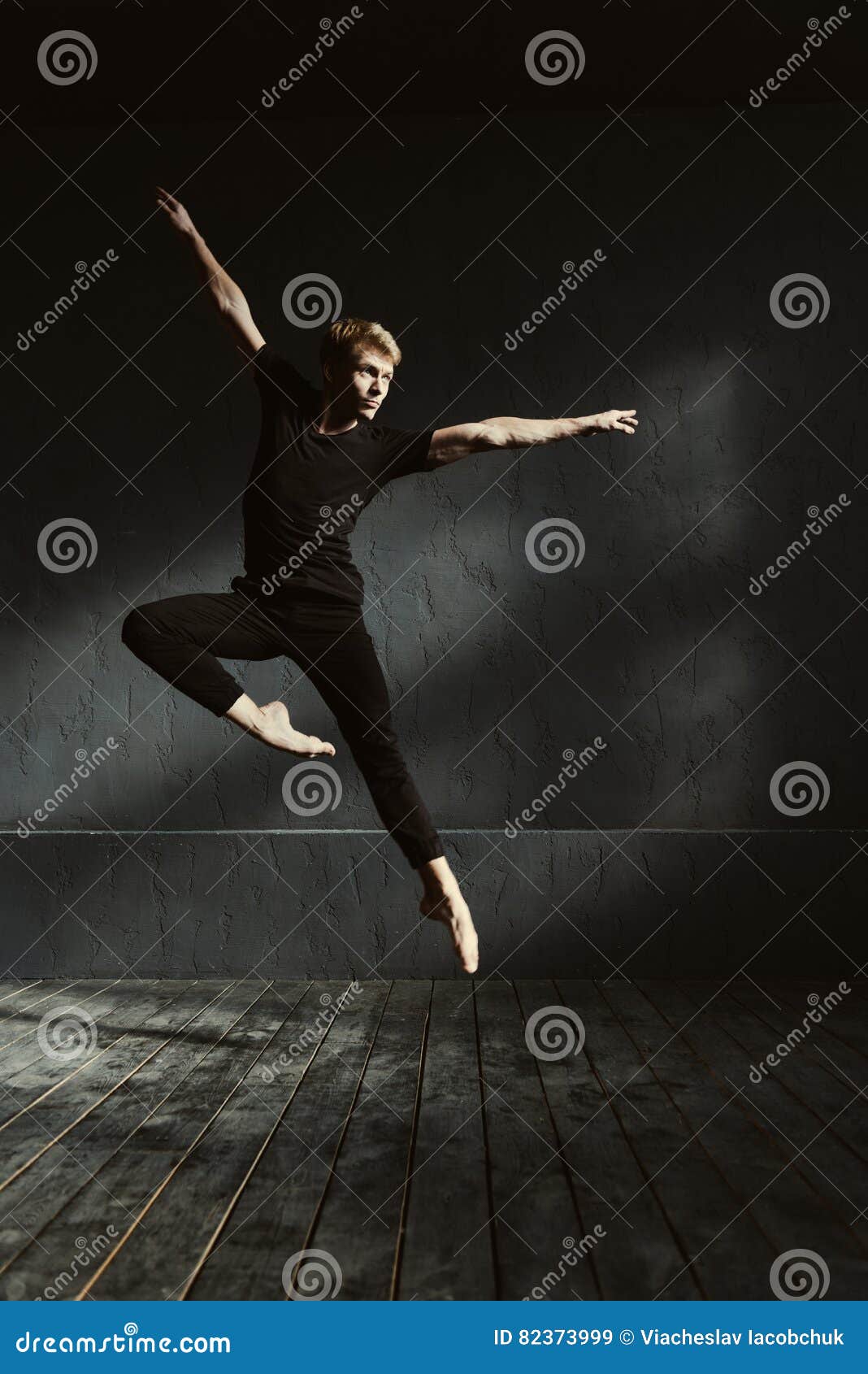 Concentrated Young Dancer Performing the Split in the Air Stock Image ...