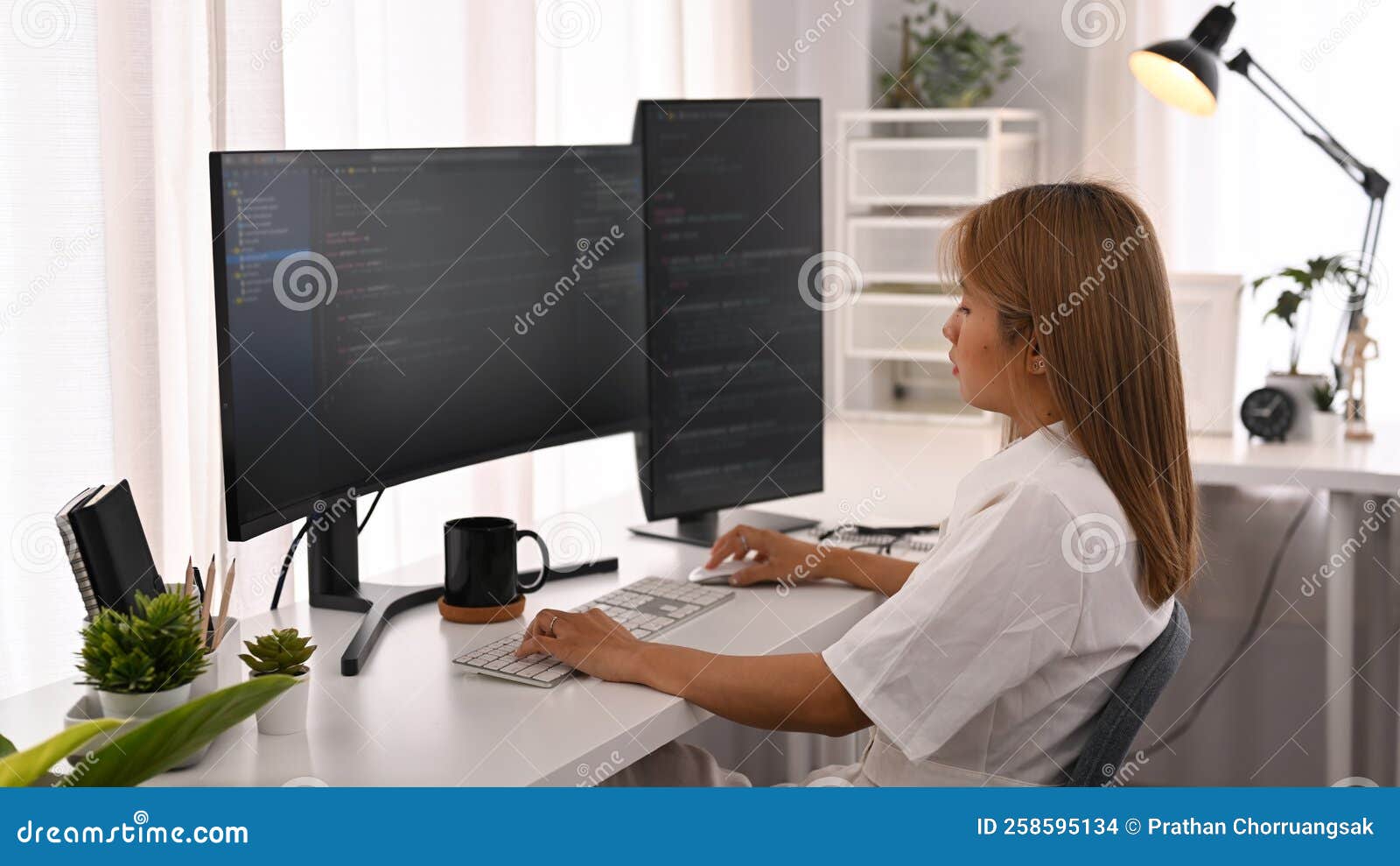 Concentrated Young Female Software Developer Working with Coded Data in ...