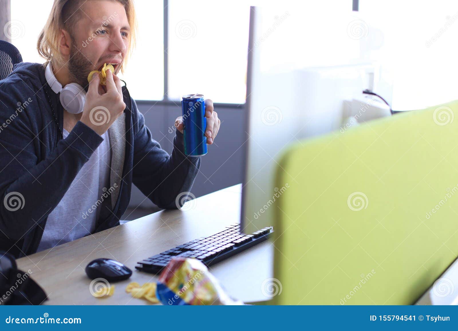 Concentrated Young Man in Casual Clothing Using Computer, Streaming ...