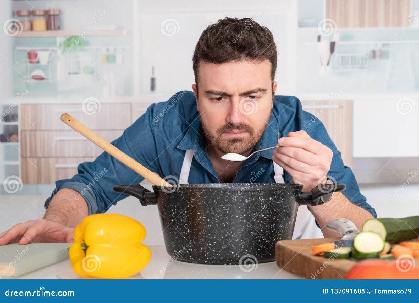 Concentrated Young Man Preparing Food at Home Stock Photo - Image of ...