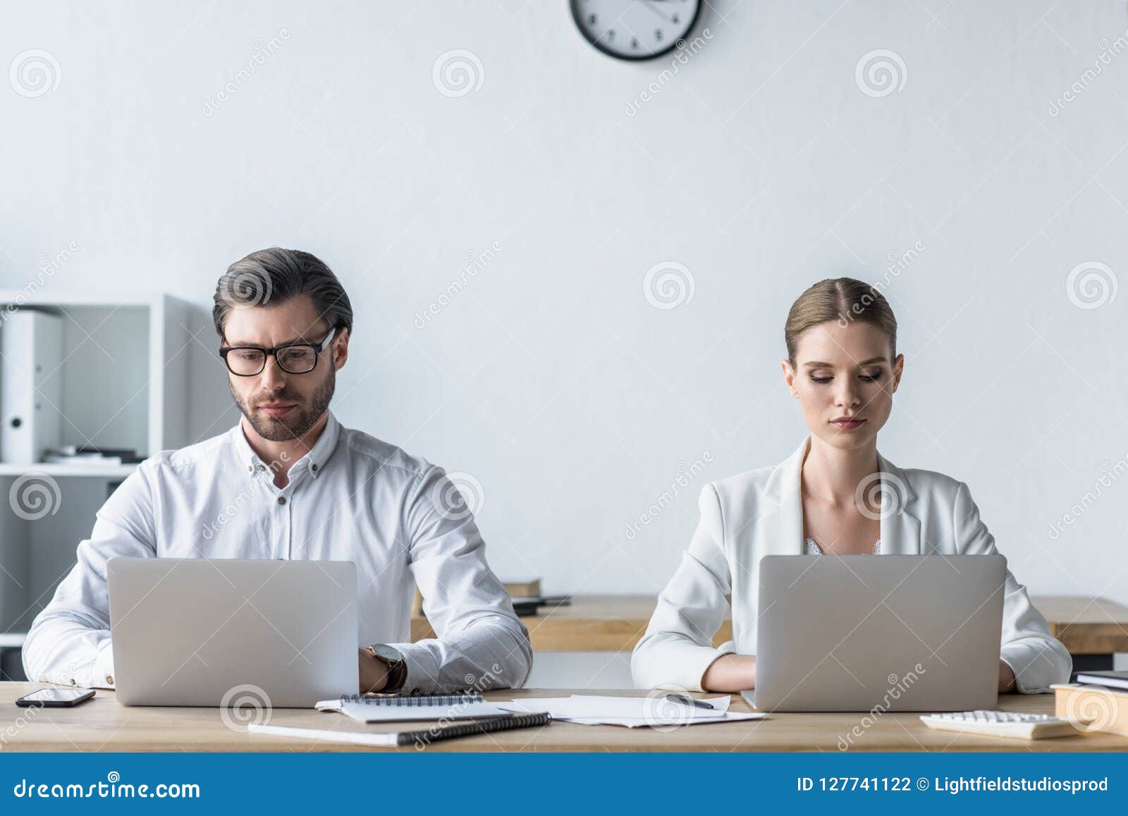 Concentrated Young Managers Working with Laptops Together Stock Photo ...