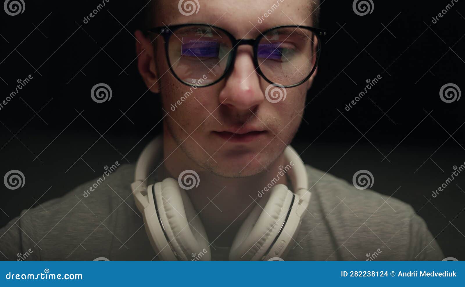 Concentrated Young Professional Programmer in Computer Glasses with ...