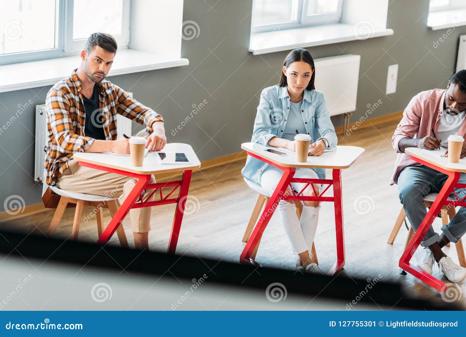 Concentrated Young Students Making Notes and Looking Stock Image ...