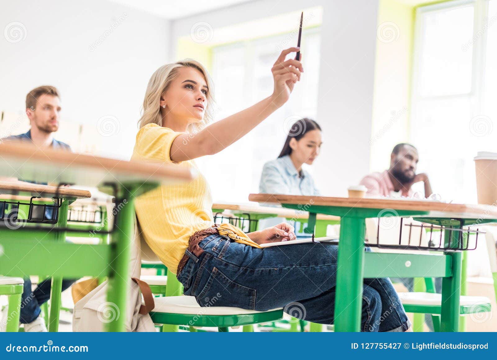 Concentrated Young Students Sitting in Classroom Stock Image - Image of ...