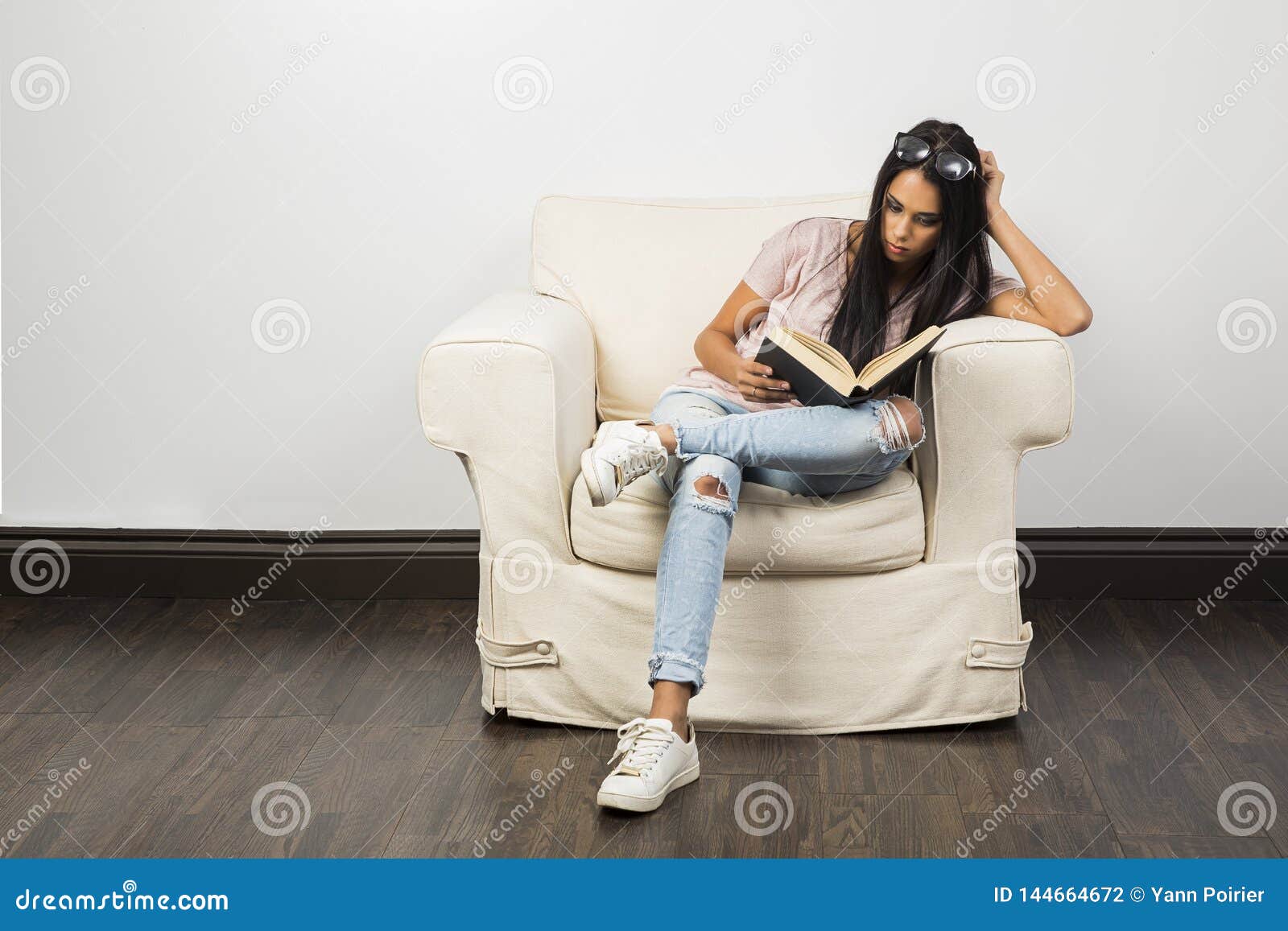 Concentrating on a book stock photo. Image of female - 144664672