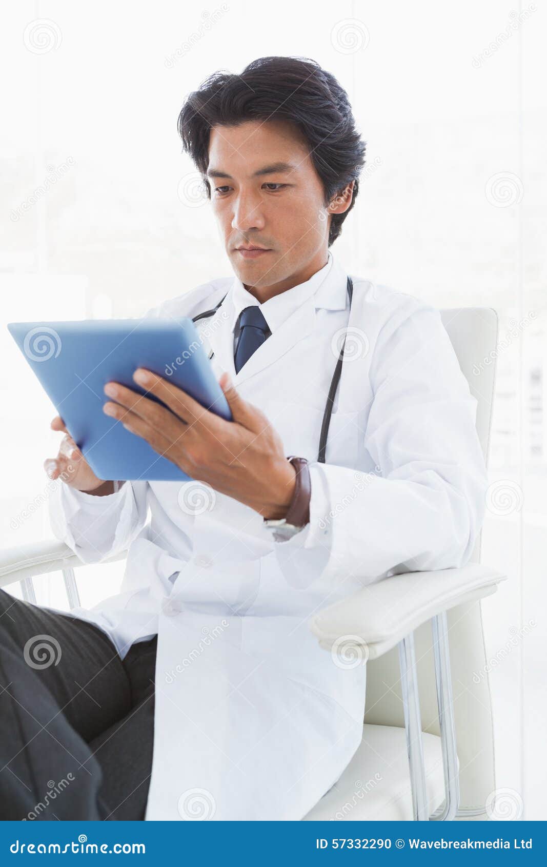 Concentrating Doctor Using a Tablet Stock Photo - Image of ...