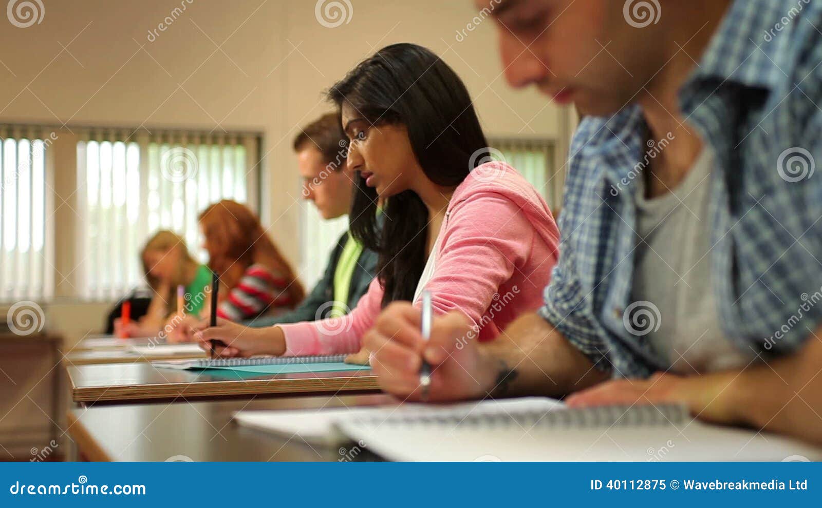 Concentrating Students Taking Notes in Class Stock Video - Video of ...