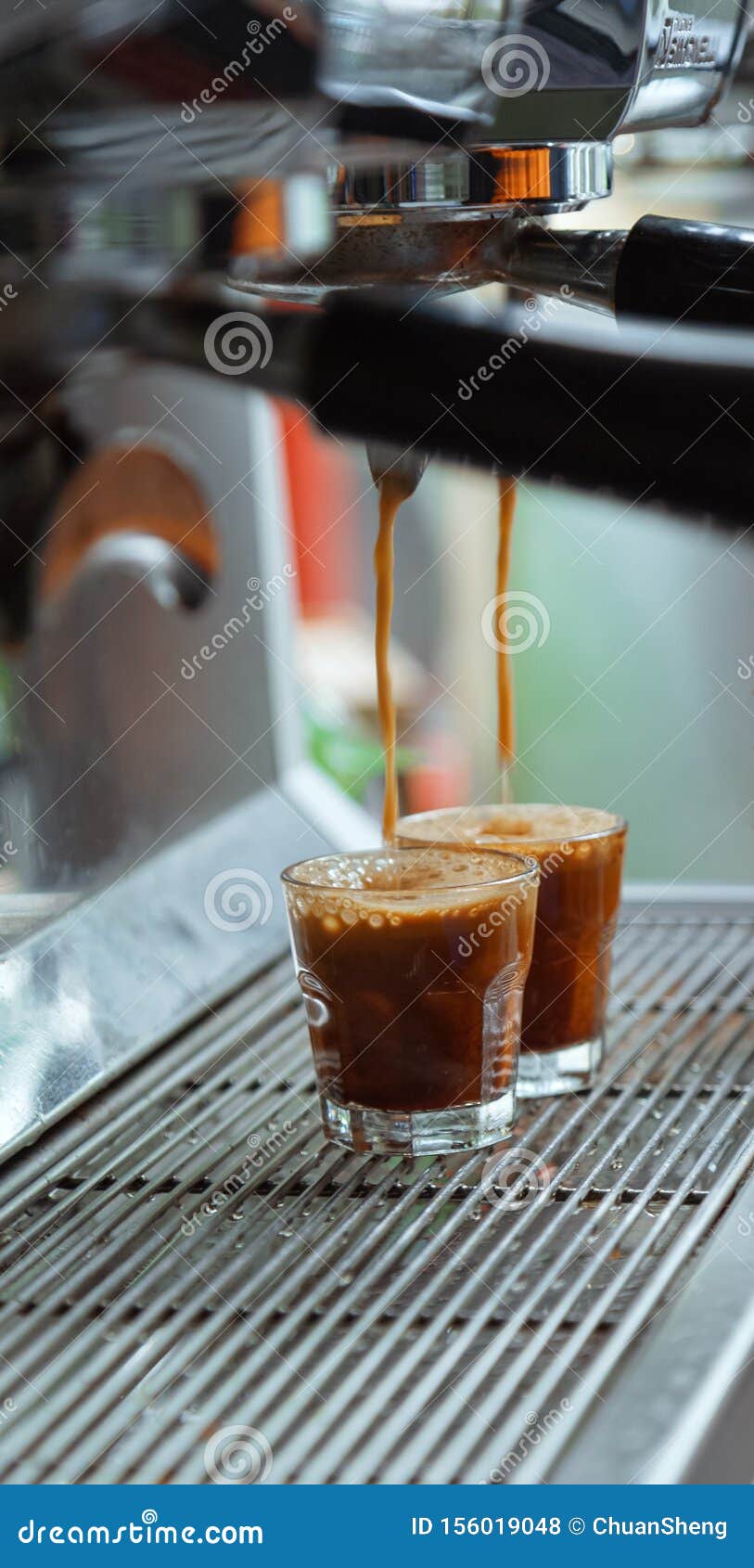 Espresso is Flowing Out. the Coffee is Flowing Out of the Slot of the ...