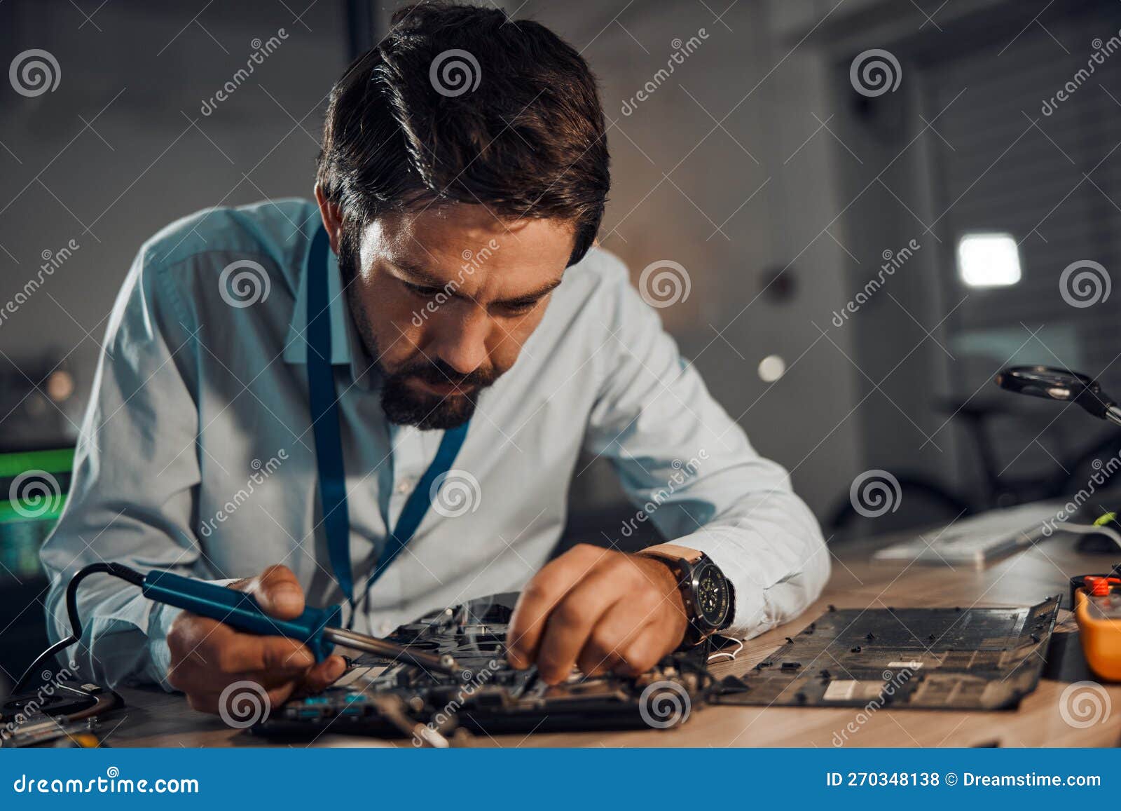 Concentration Man, it or Soldering Motherboard in Engineering Workshop ...