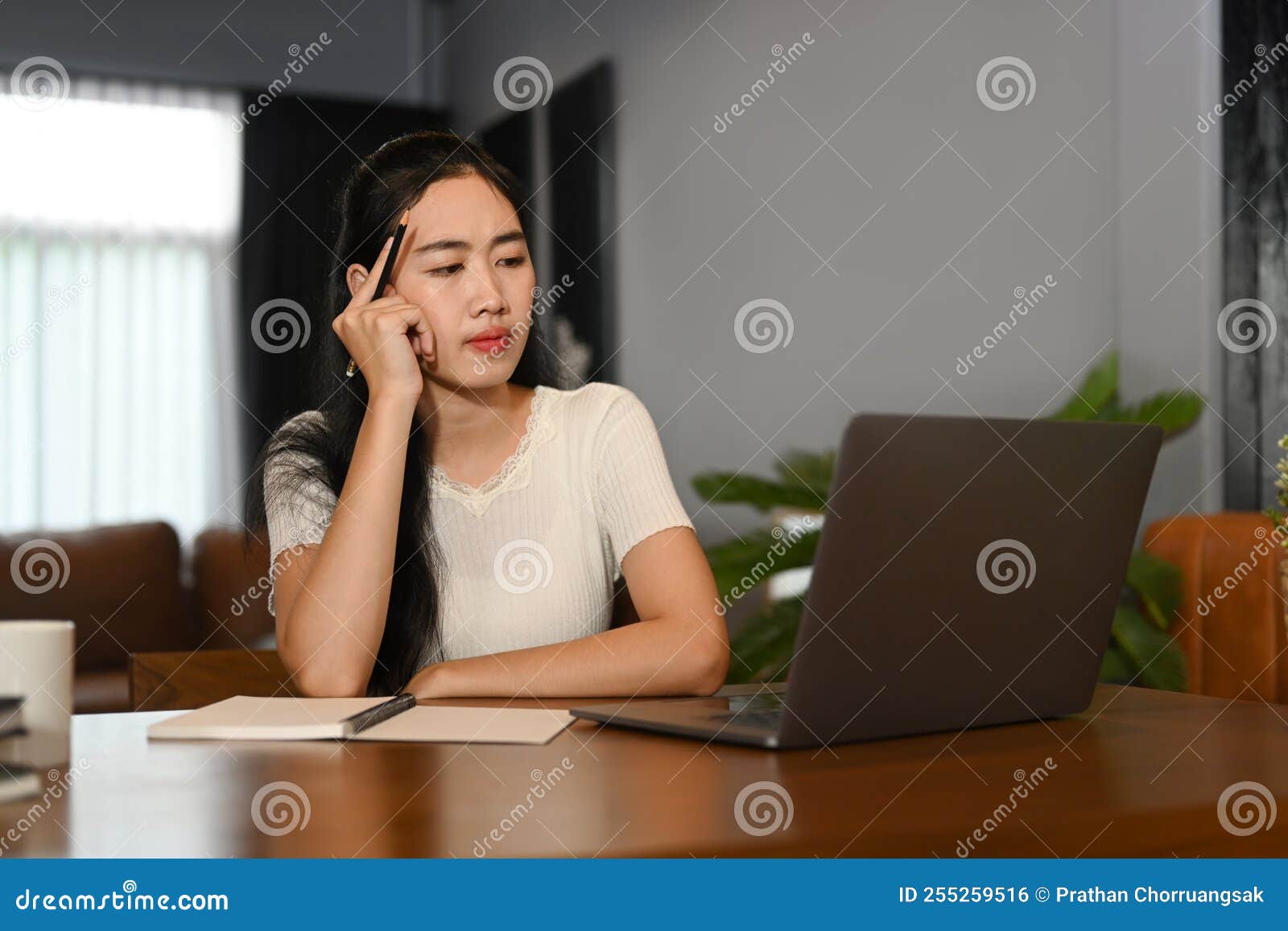 Concentred Young Woman Looking at Computer Tablet while Studying Online on Web Virtual Class at ...