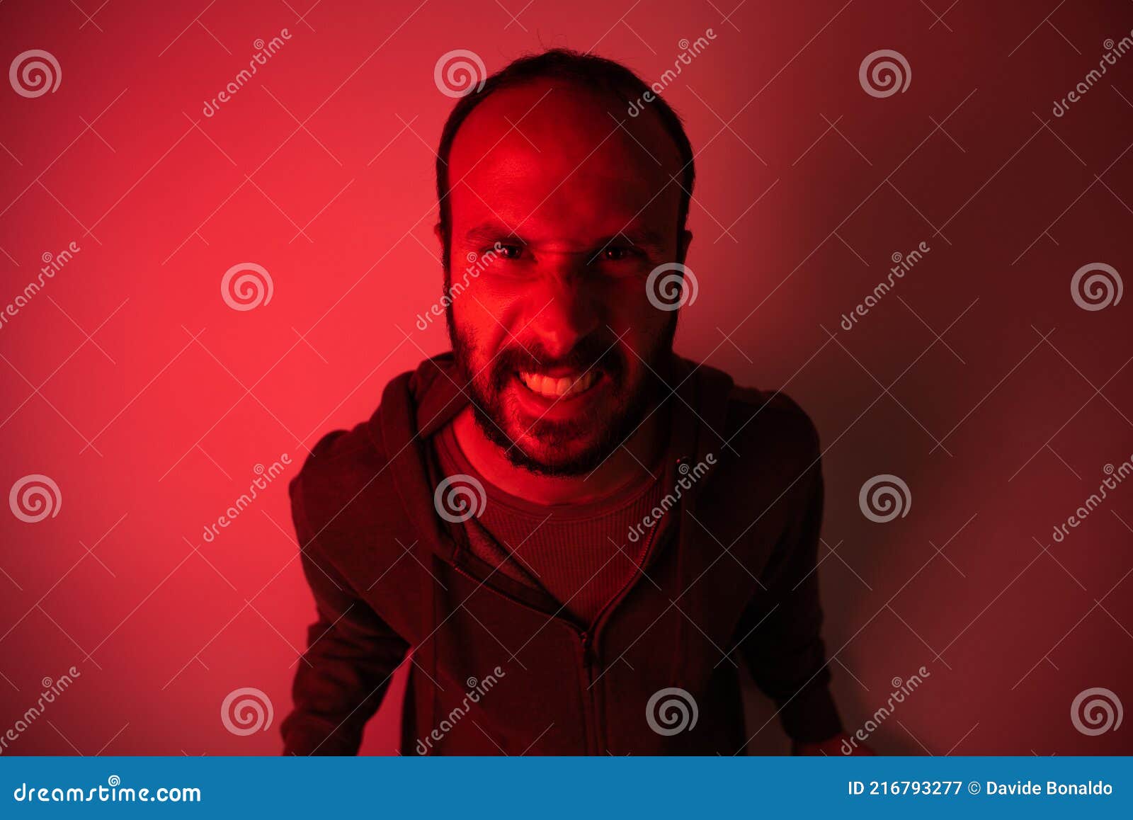 Concept Af Angry and Abusive Man with Red Light. Studio Portrait of ...