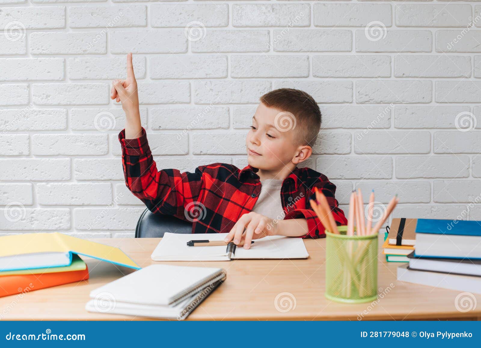Concept Back To the School. a Boy in the Process of Studying Sits at a ...