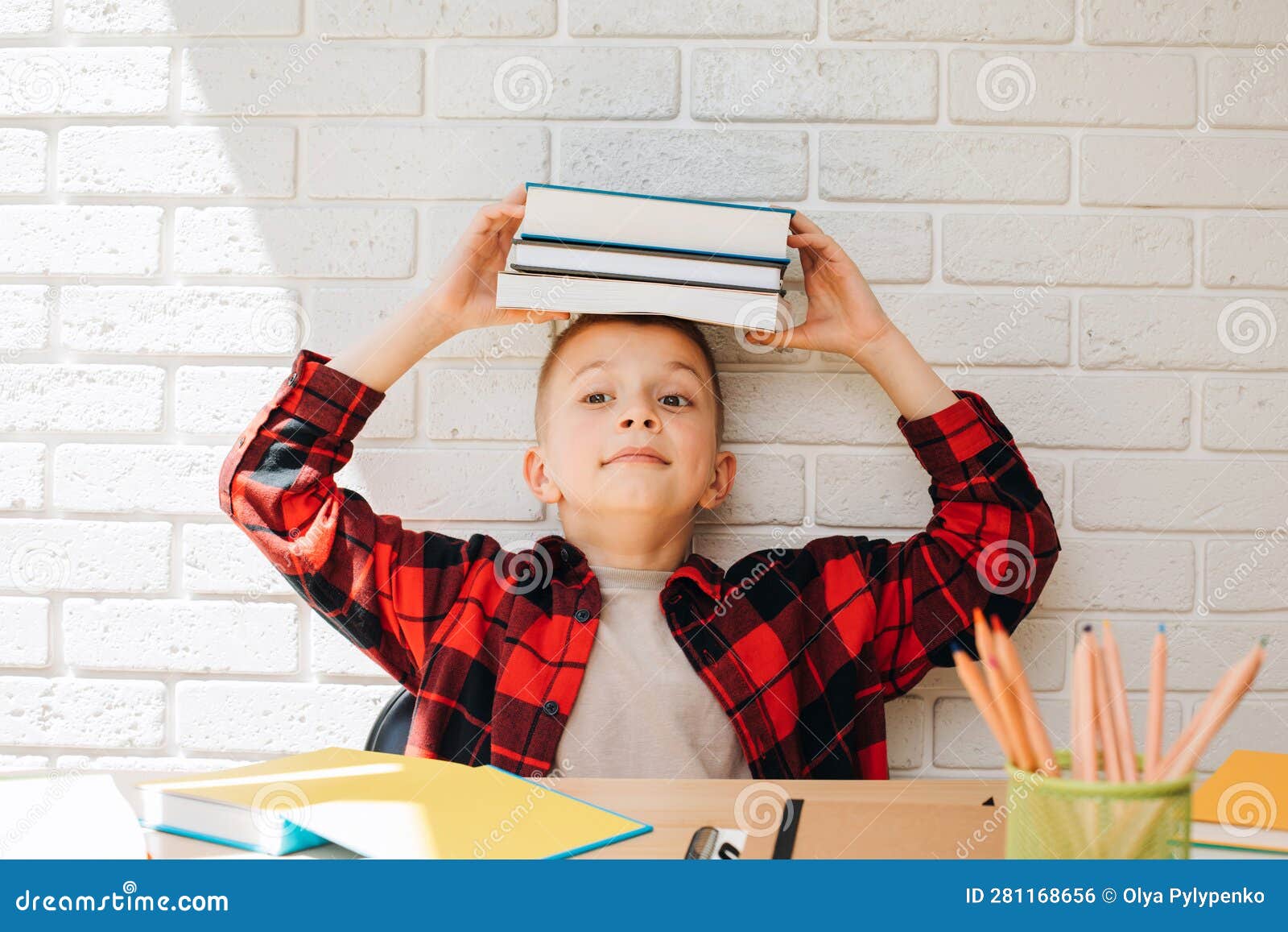 Concept Back To the School. a Boy in the Process of Studying Sits at a ...