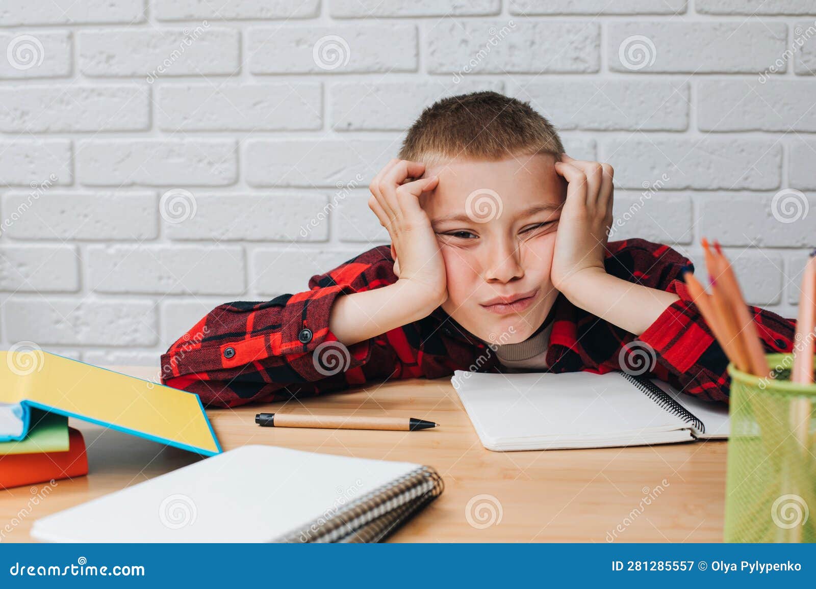 Concept Back To the School. a Boy in the Process of Studying Sits at a ...
