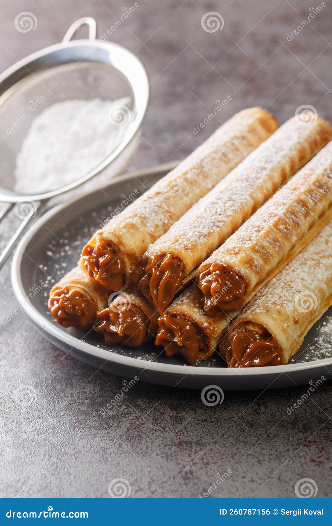 Concept of Breakfast with Wafer Rolls with Condensed Milk Closeup in ...