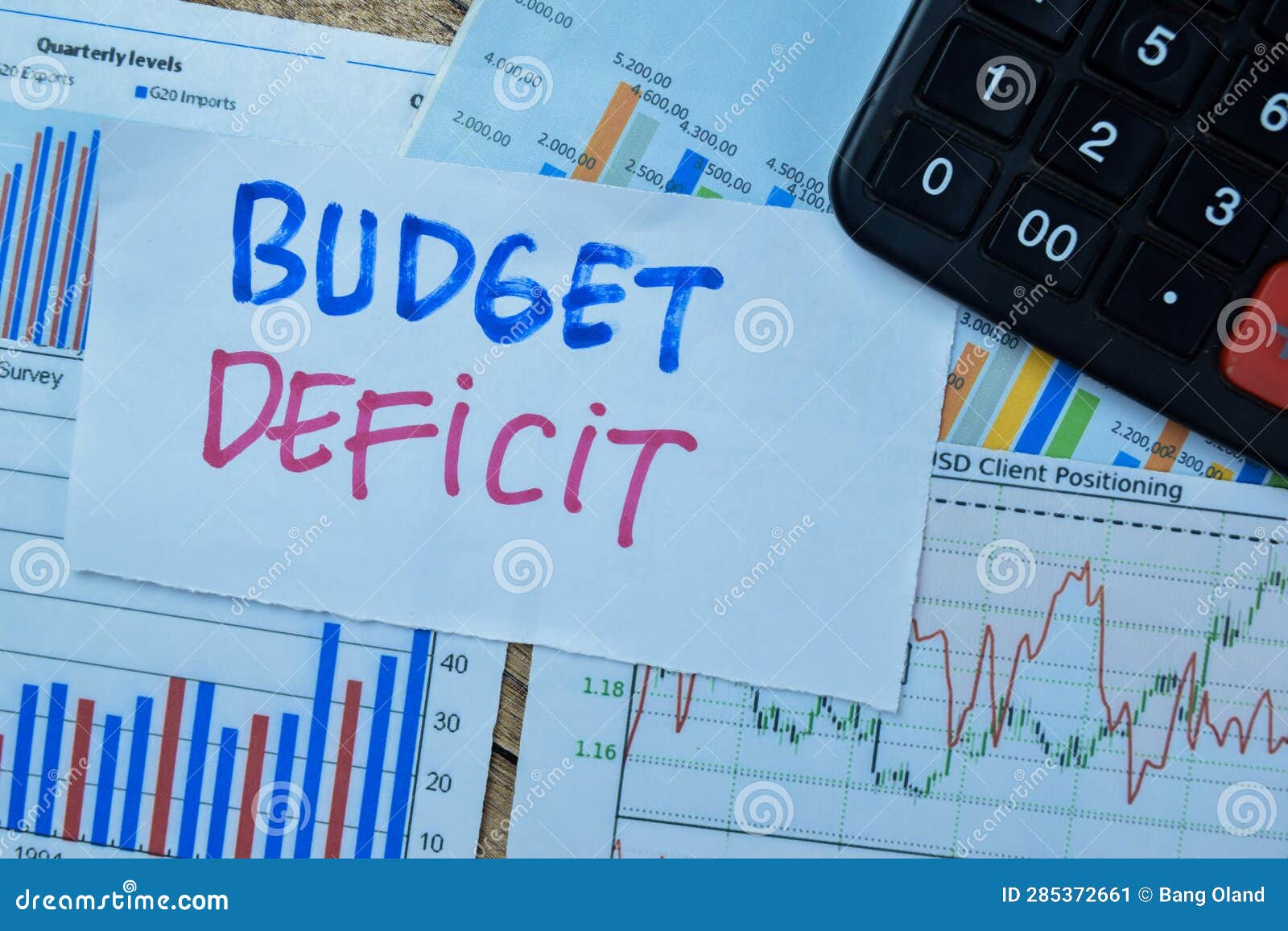 Concept of Budget Deficit Write on Sticky Notes Isolated on Wooden ...