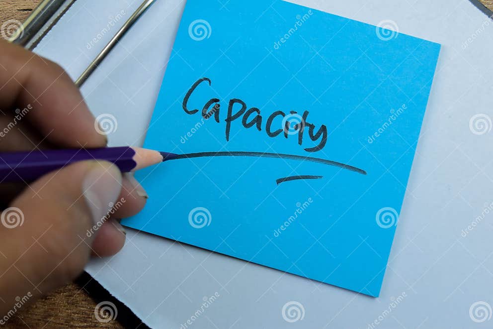 Concept of Capacity Write on Sticky Notes Isolated on Wooden Table ...