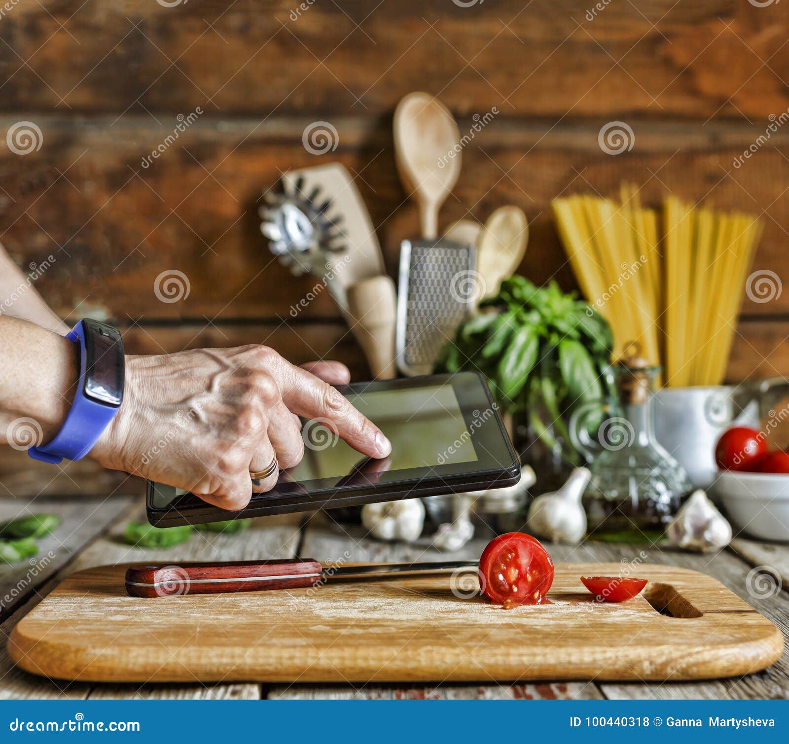 Concept: Cooking in the Kitchen in the Restaurant. the Cook is Holding ...