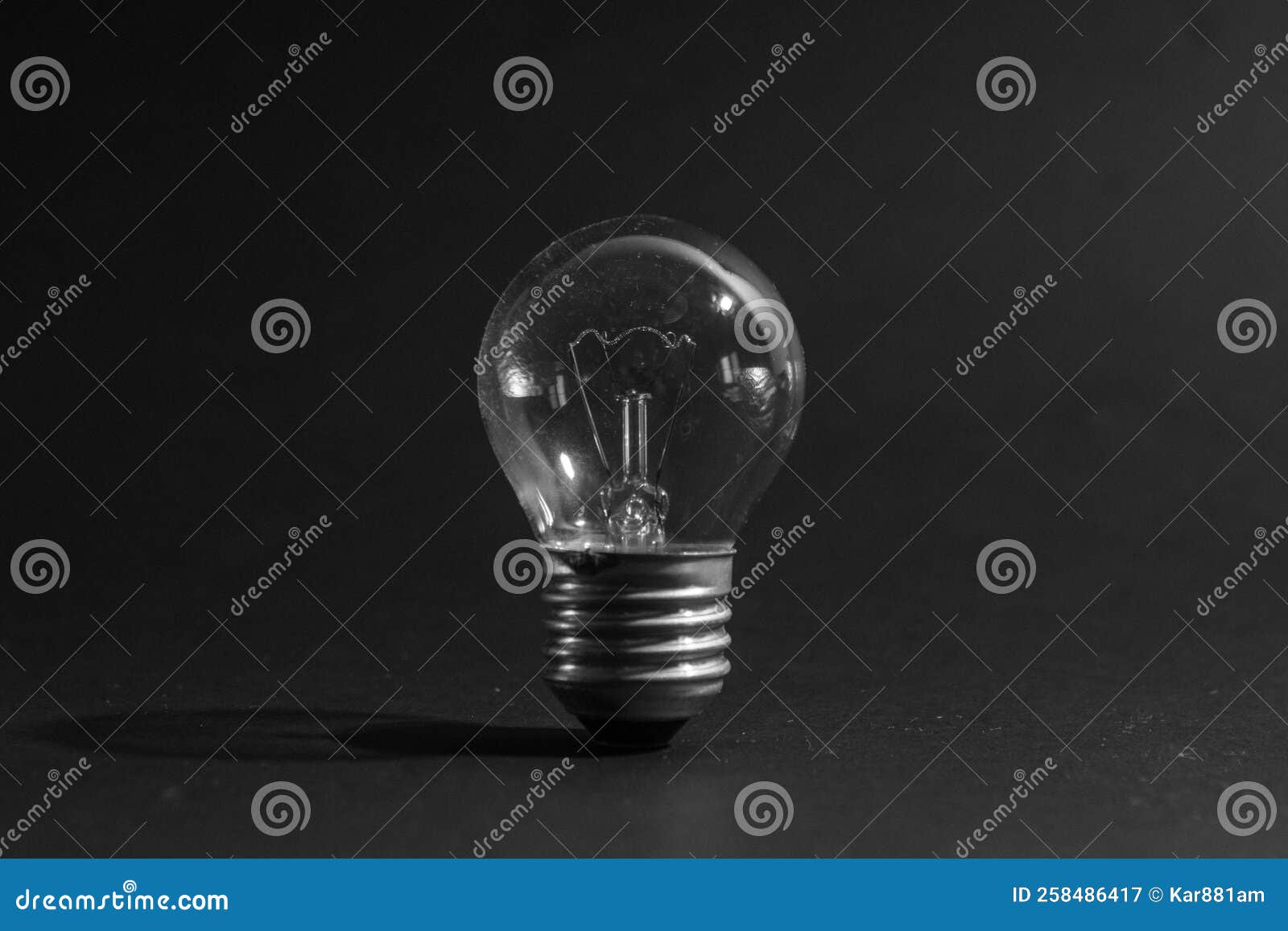 Concept Crisis of Electricity, Electric Light Bulb on Black Background ...