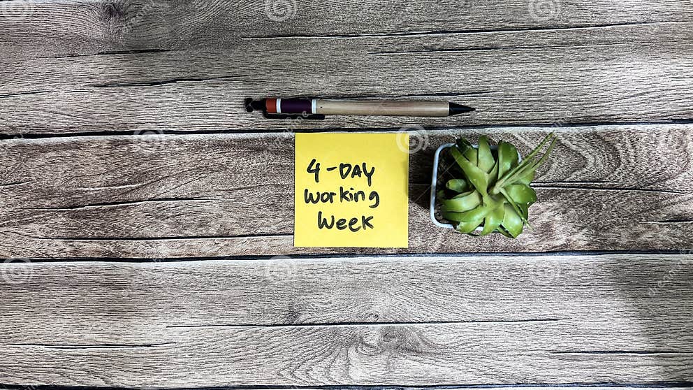 Concept of 4 Day Working Week Write on Sticky Notes Isolated on Wooden ...