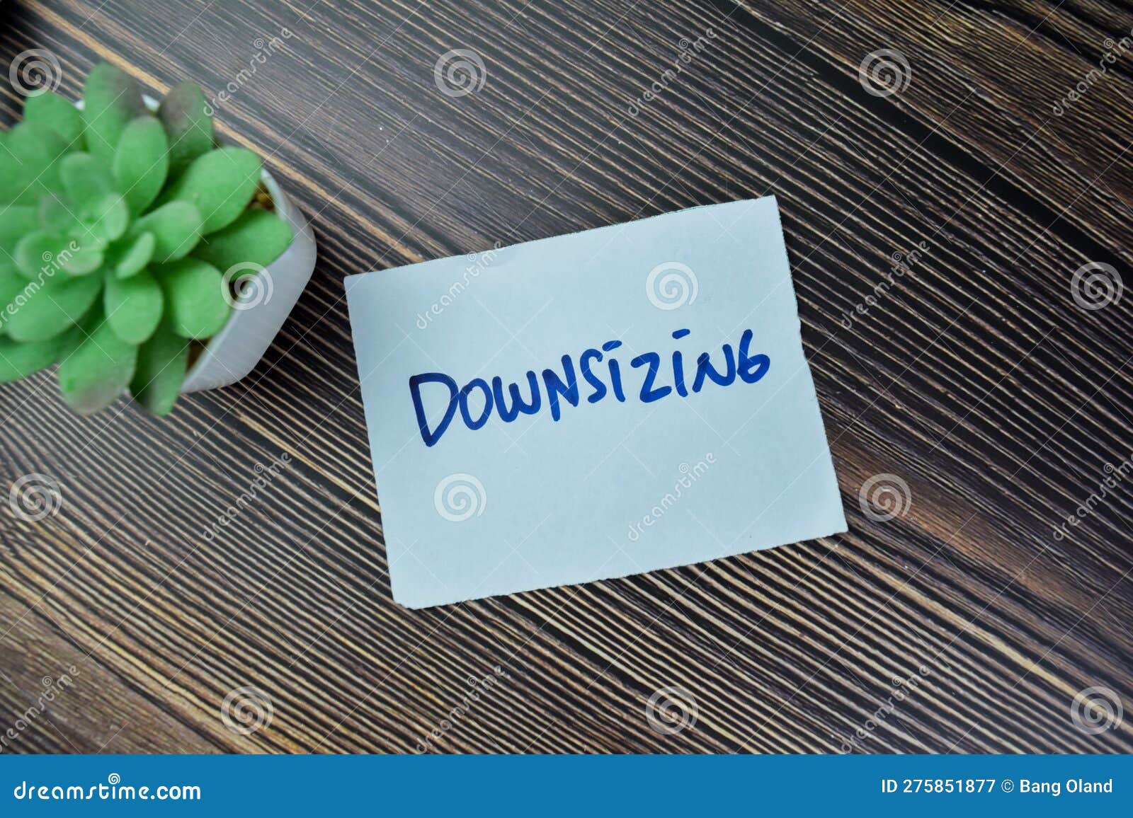 Concept of Downsizing Write on Sticky Notes Isolated on Wooden Table ...