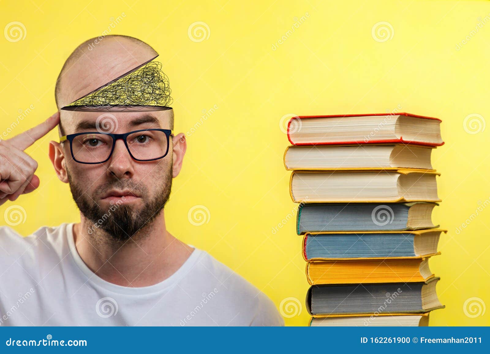 Concept Of Education A Bald Bearded Man With Glasses Points To His