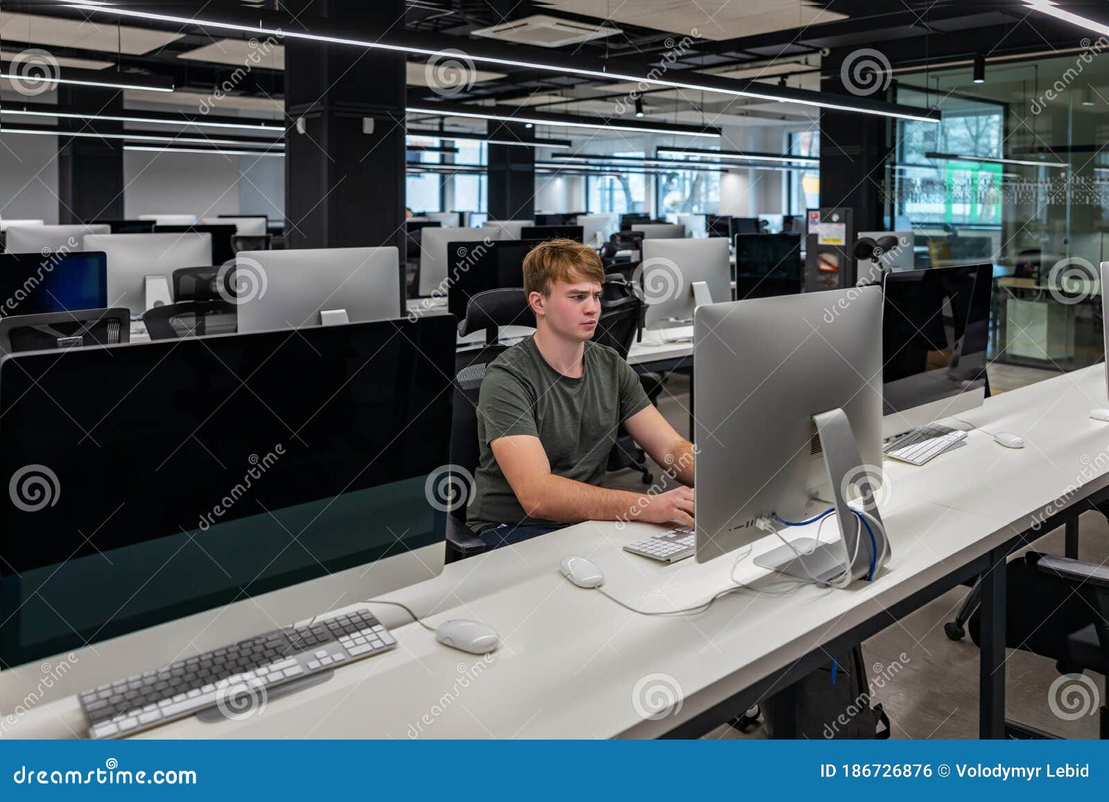 The Concept of Education, a Young Man Sits at a Computer, Teaches ...