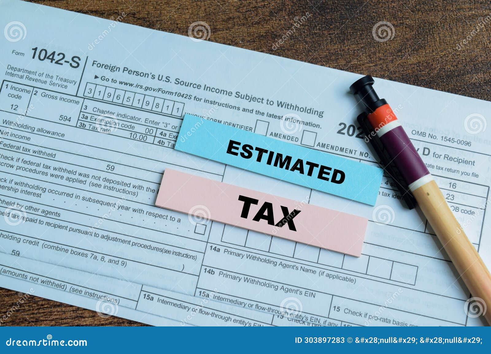 Concept of Estimated Tax Write on Sticky Notes Isolated on Wooden Table ...