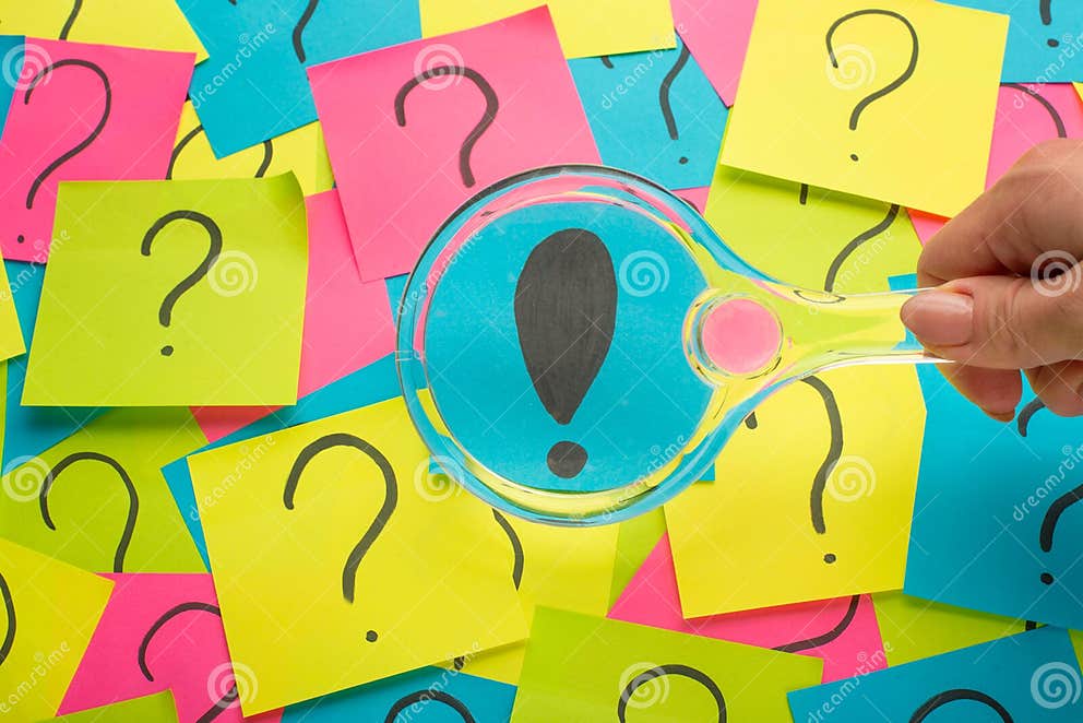 Concept with an Exclamation Point on a Sticky Note and Magnifying Glass ...