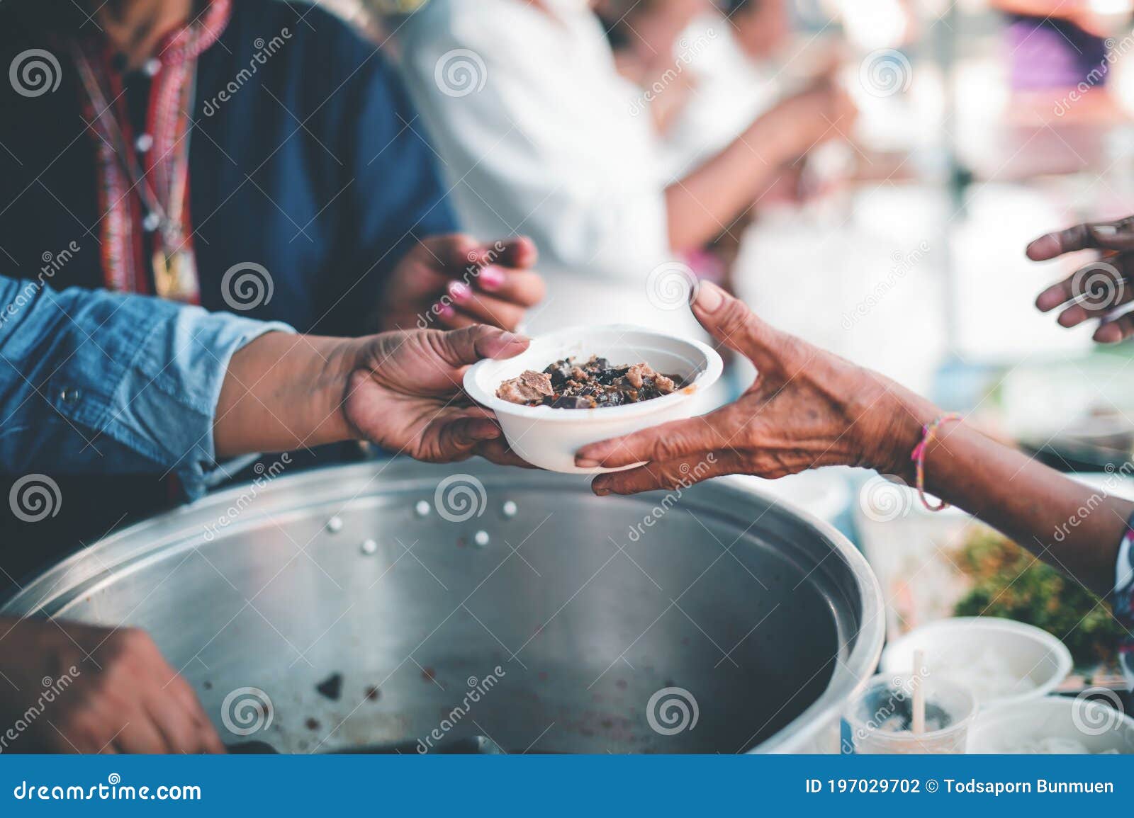 Providing Free Food To The Poor Volunteers Scooping Out Food To Give ...