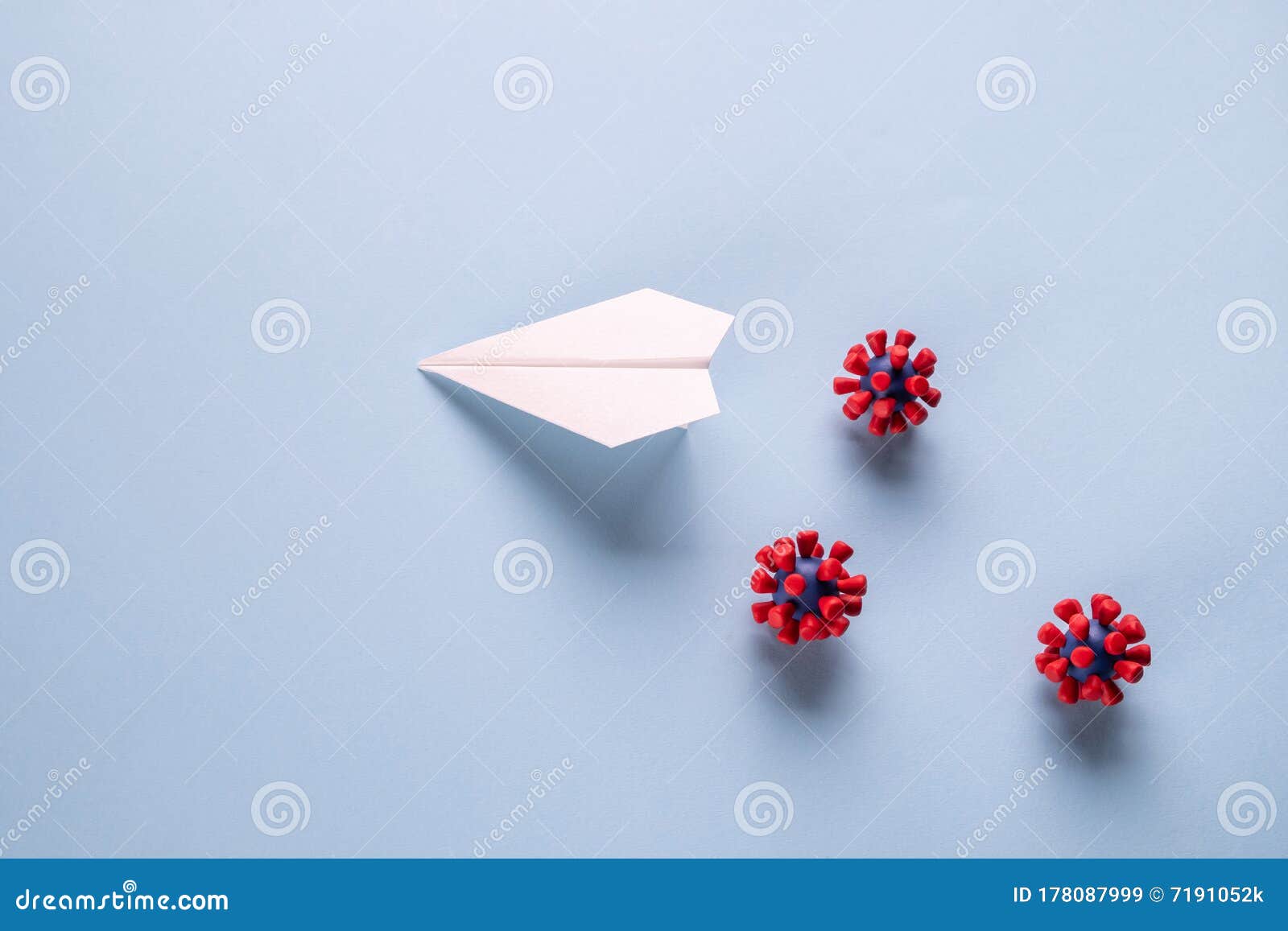 Concept of Fly Danger. Paper Plane and Models of Covid-19 Virus on Blue ...
