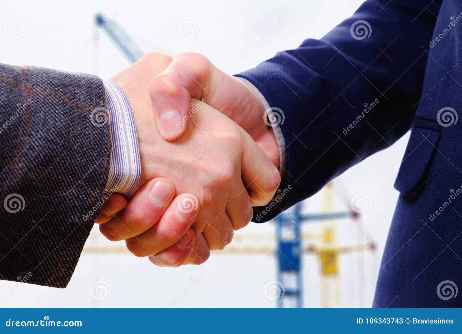 Handshake Between Builder Edilee And Engineer Behind The City Under ...