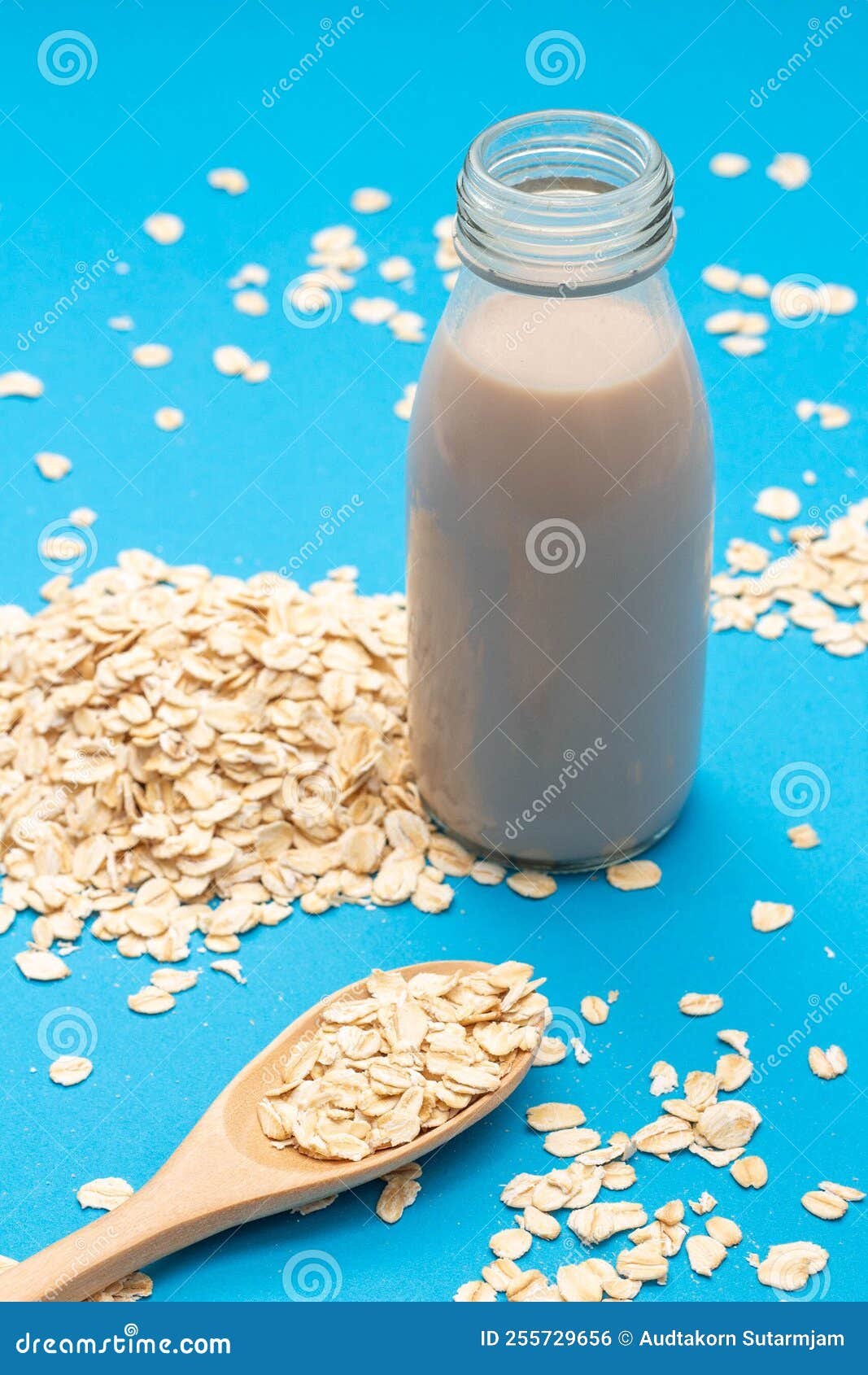 Concept of Healthy Grain, Oat Milk in Bottle and Oat Flakes in Spoon ...
