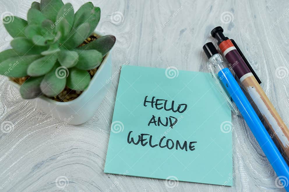 Concept of Hello and Welcome Write on Sticky Notes Isolated on Wooden ...