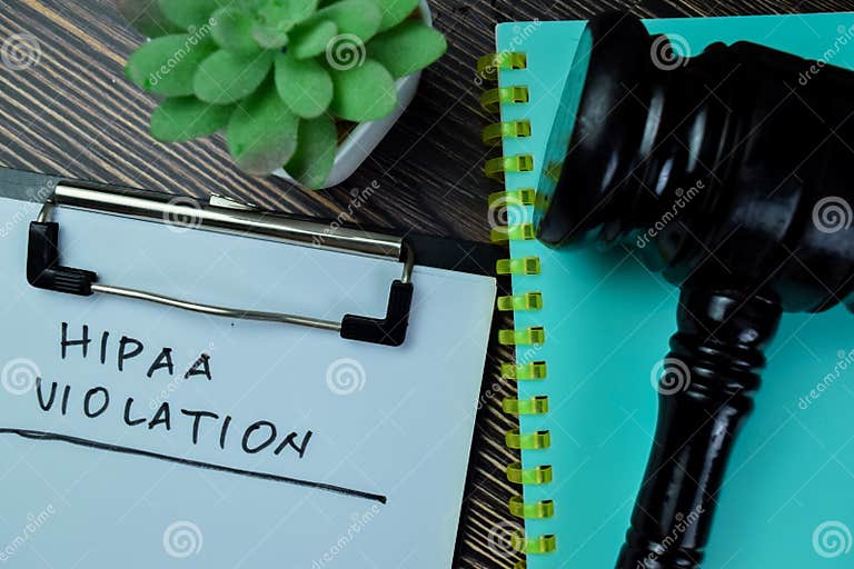 Concept of HIPAA Violation Write on Paperwork Isolated on Wooden Table ...