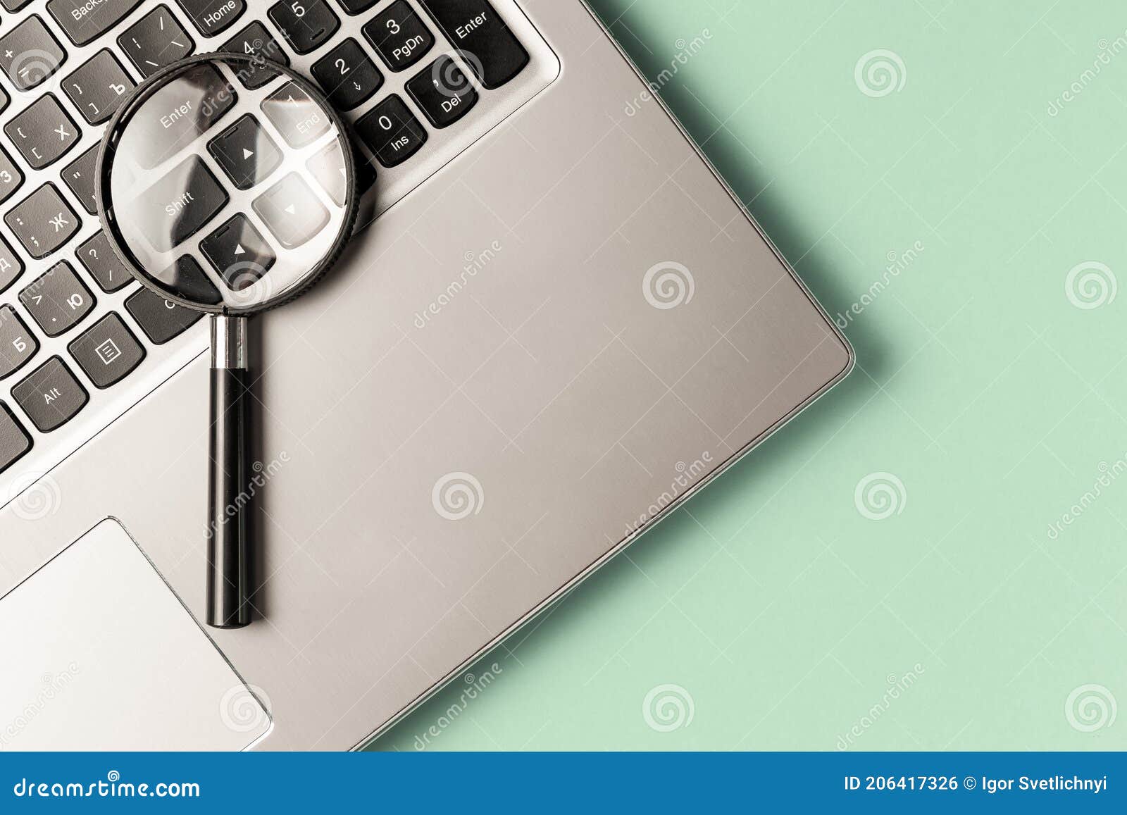 Concept Information Search. Laptop Computer with Magnifying Glass on ...